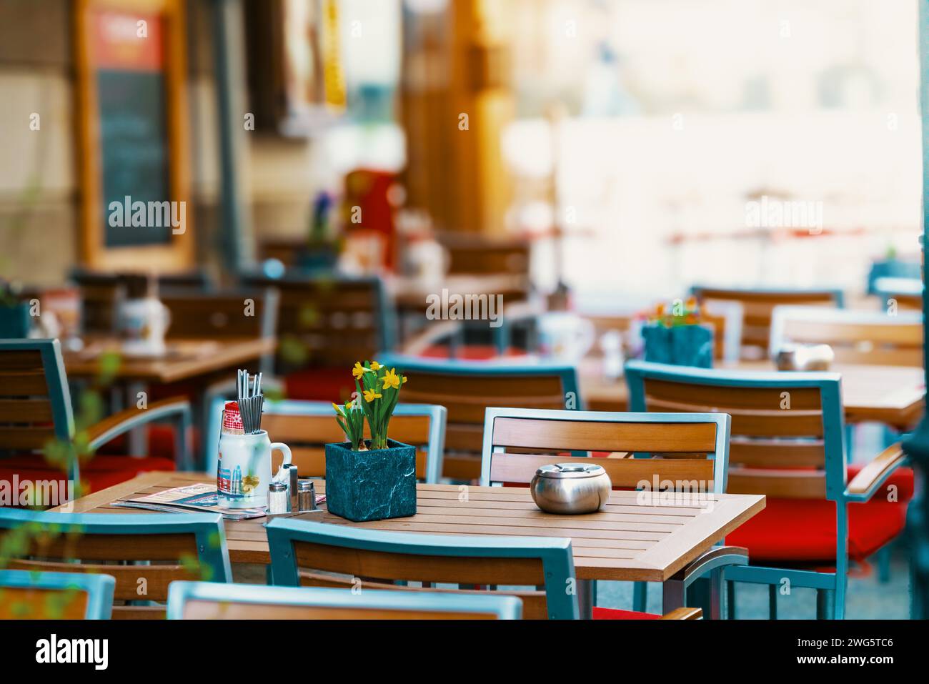 chairs and tables of a street restaurant in an empty city Stock Photo ...
