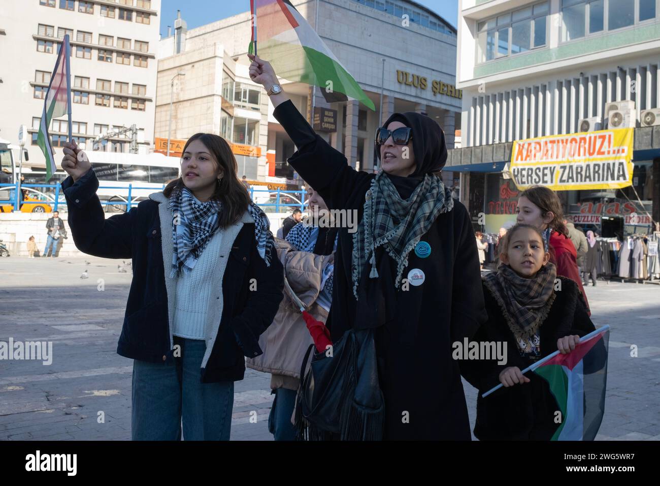 Protesters hold Palestinian flags during the demonstration. Protests ...