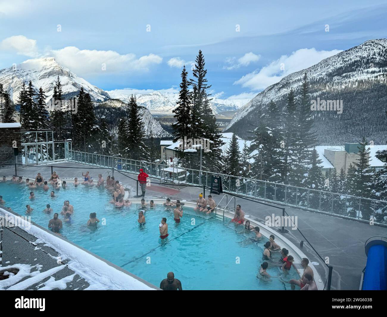 Unidentified people soaking in the Banff Hot Springs on a clear sunny ...