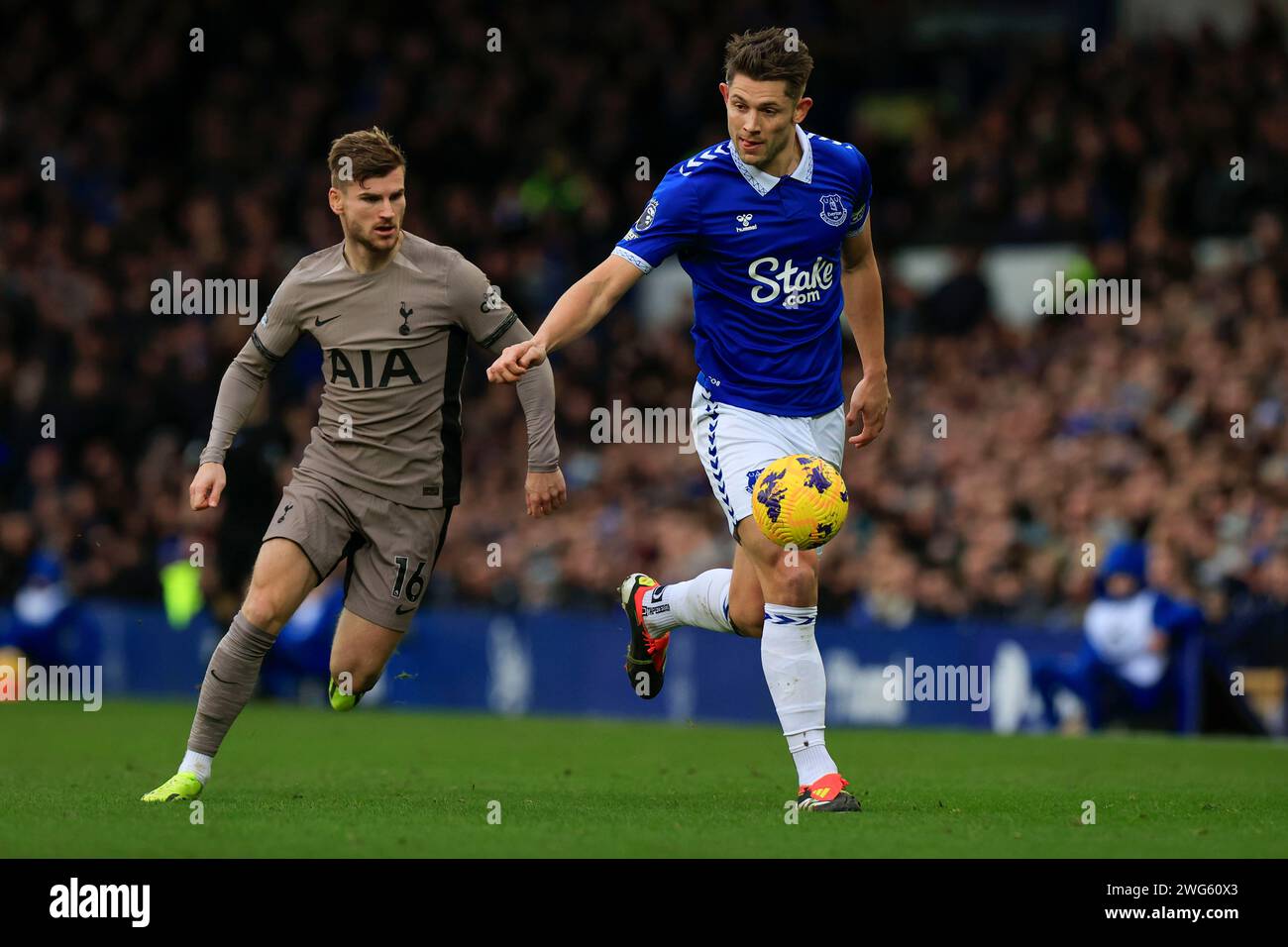 James Tarkowski of Everton controls the ball watched by Timo Werner of ...