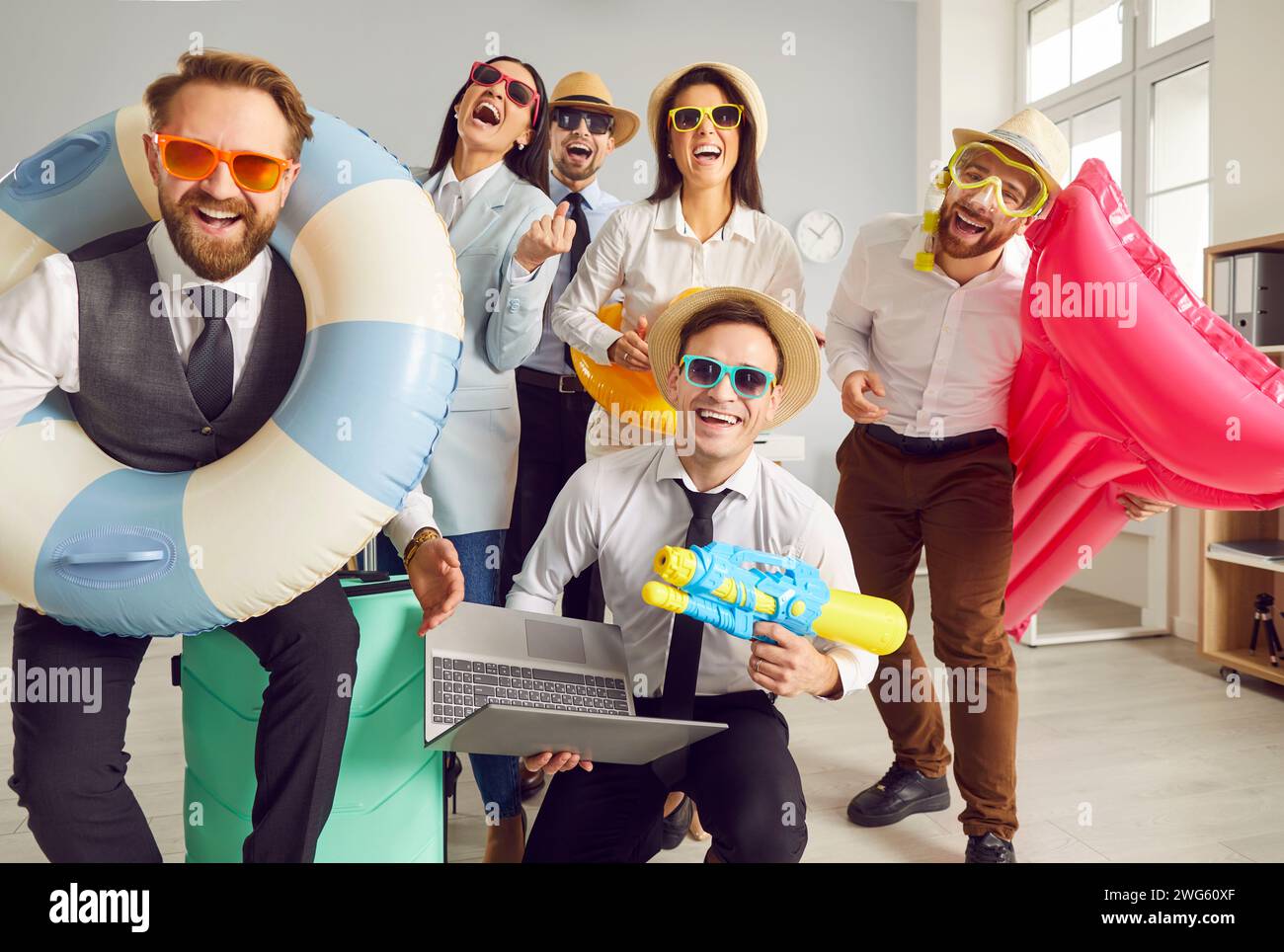 Team Preparing for Summer Vacation Stock Photo - Alamy