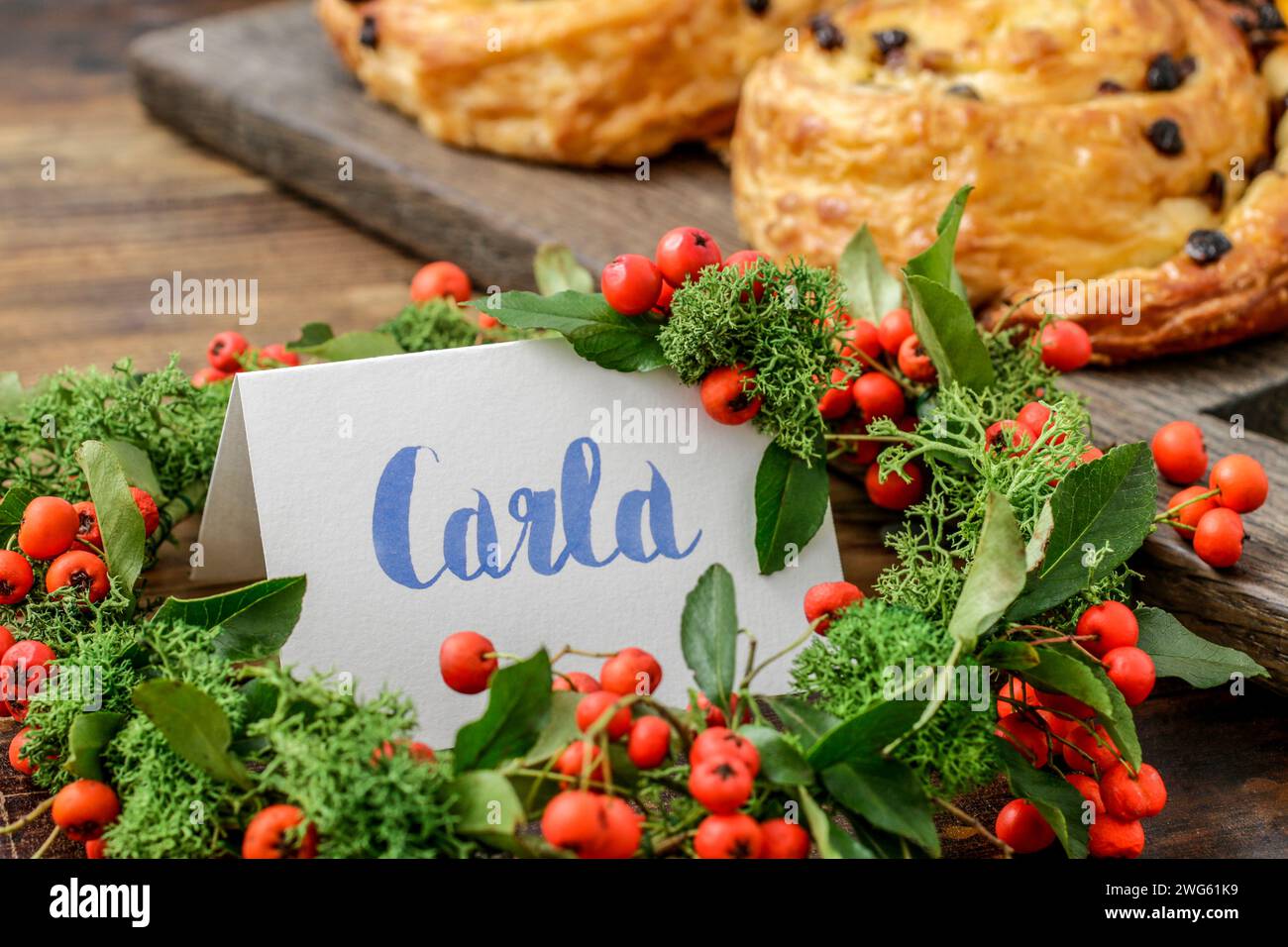 Table place name card with handwritten name Carla. Party decor Stock ...