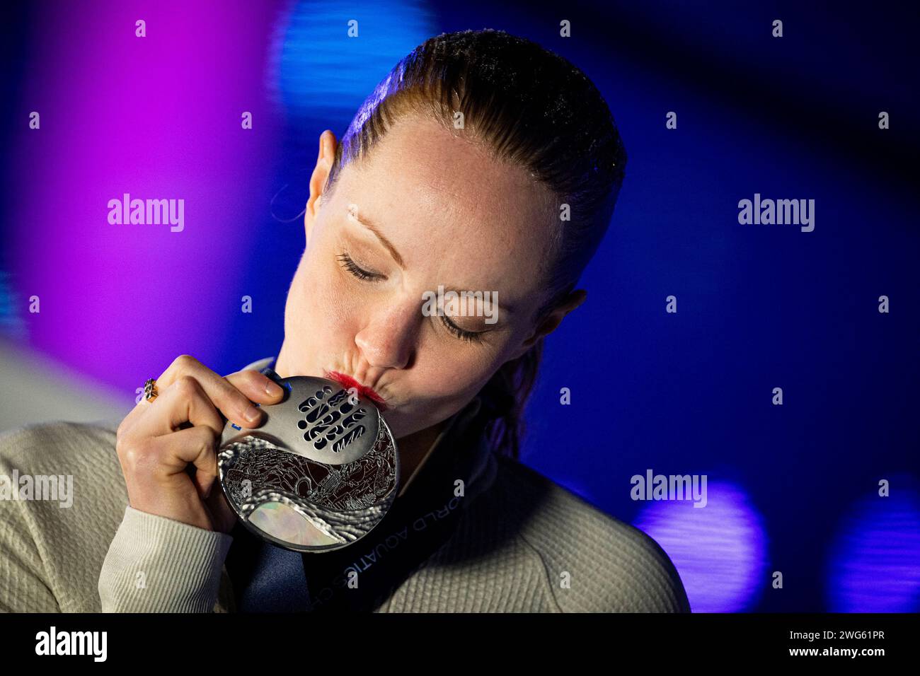 Jacqueline Simoneau of Canada shows the silver medal after competing in ...