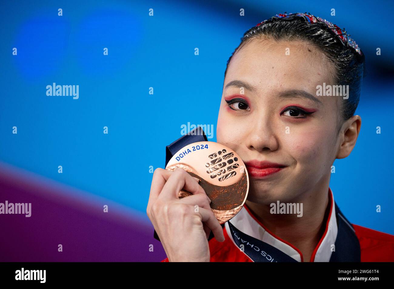 Doha, Qatar. 03rd Feb, 2024. Huiyan Xu of China shows the bronze medal ...