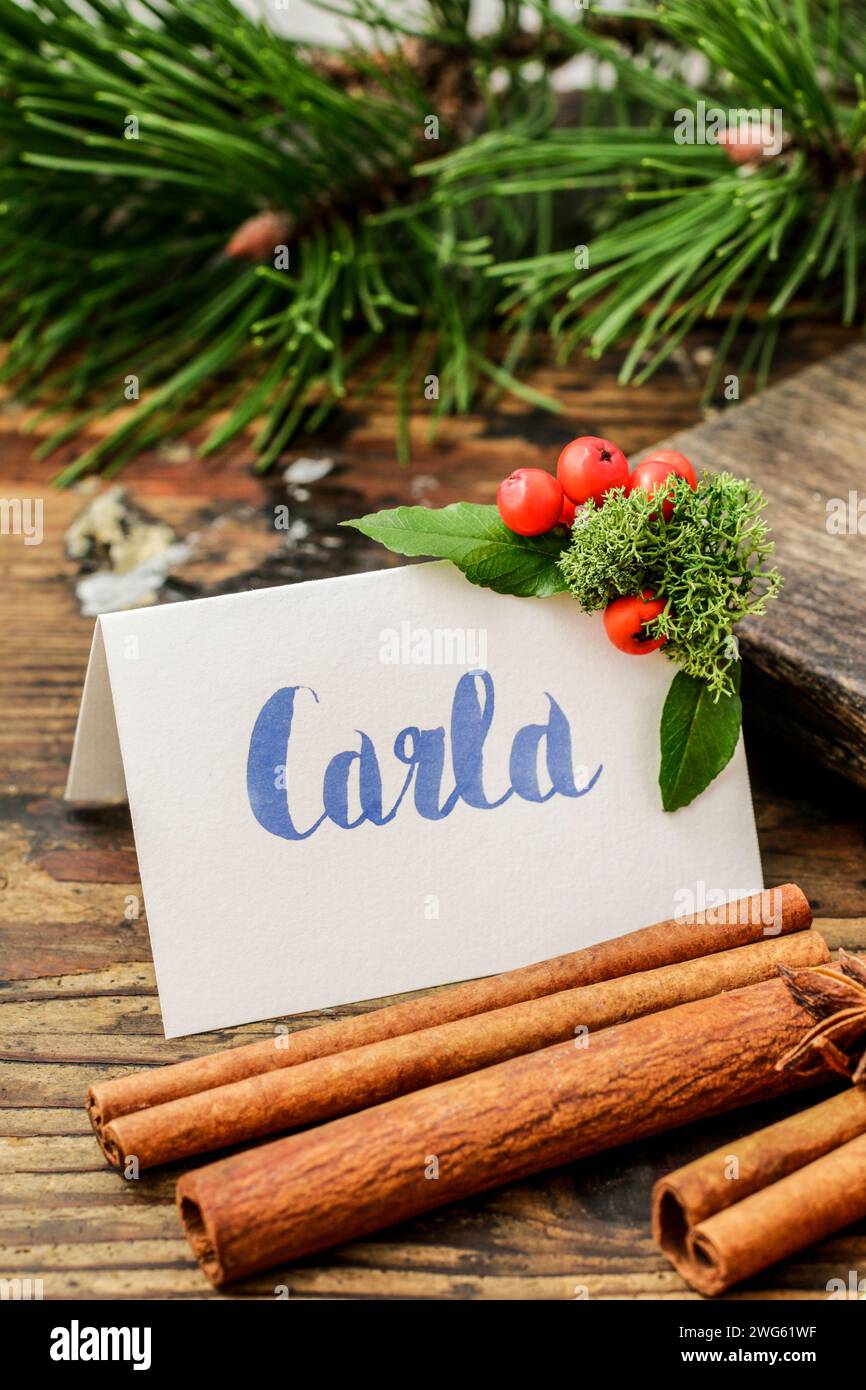 Table place name card with handwritten name Carla. Party decor Stock ...