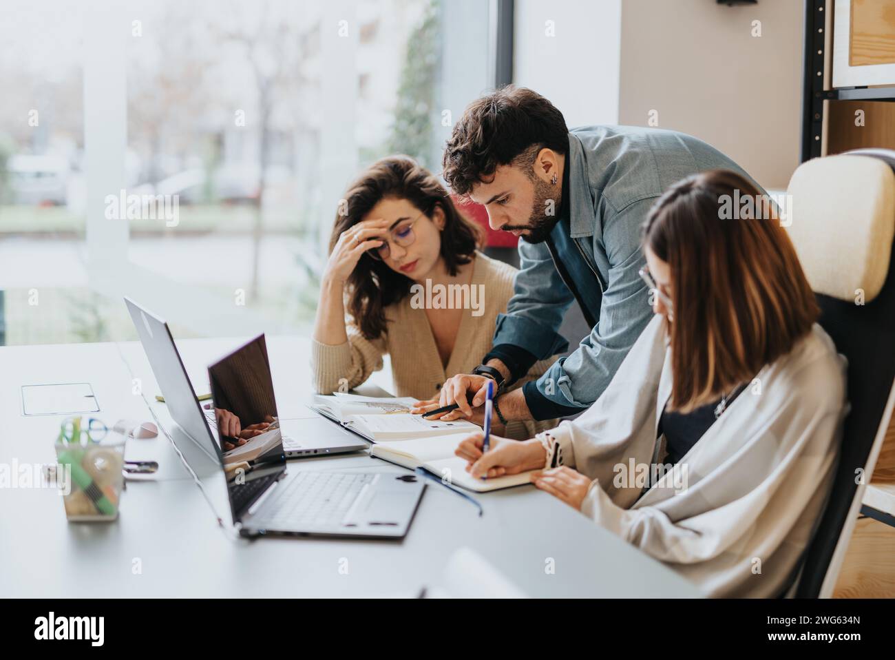 Successful teamwork in a modern, multicultural office space Stock Photo ...