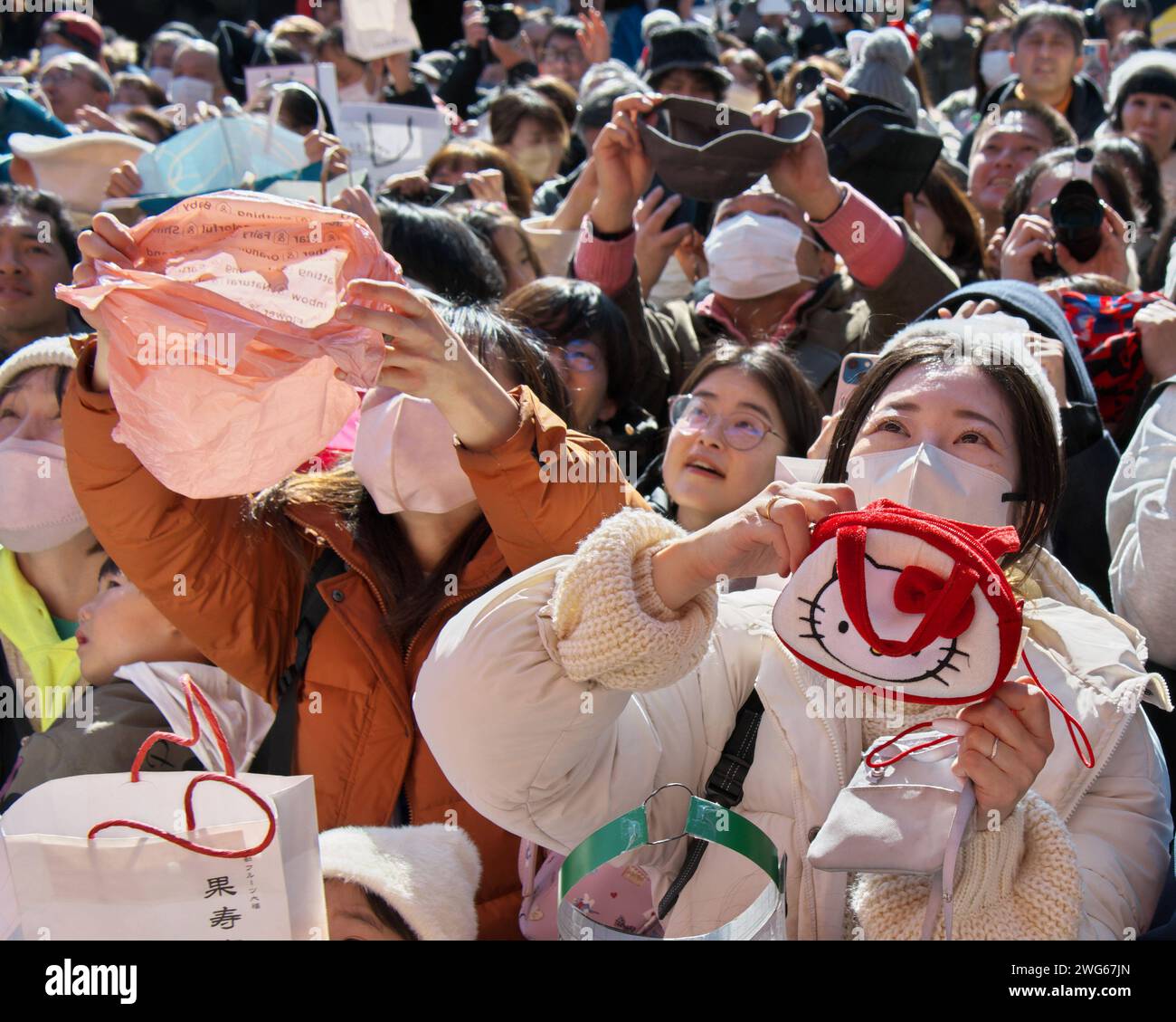Tokyo, Japan. 03rd Feb, 2024. People try to catch lucky beans during ...