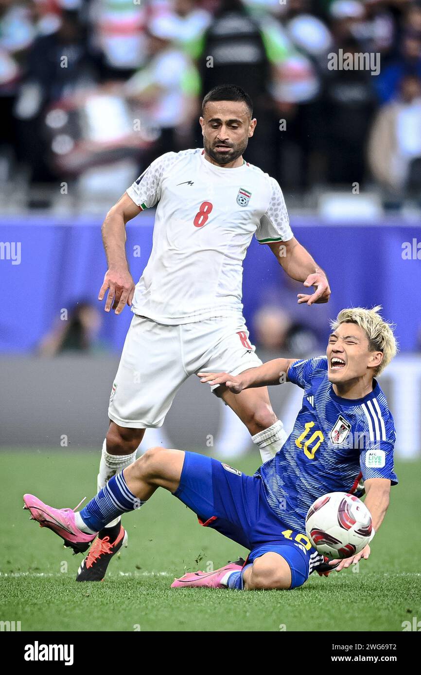 Doha, Qatar. 3rd Feb, 2024. Japan's Doan Ritsu (R) vies with Iran's Omid Ebrahimi during the ...