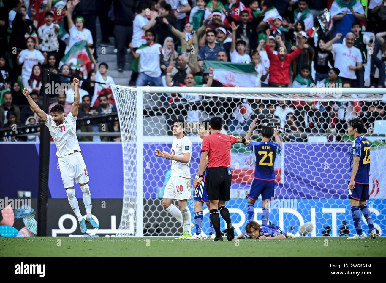 Doha, Qatar. 3rd Feb, 2024. Referee Ma Ning (4th R) of China awards a ...
