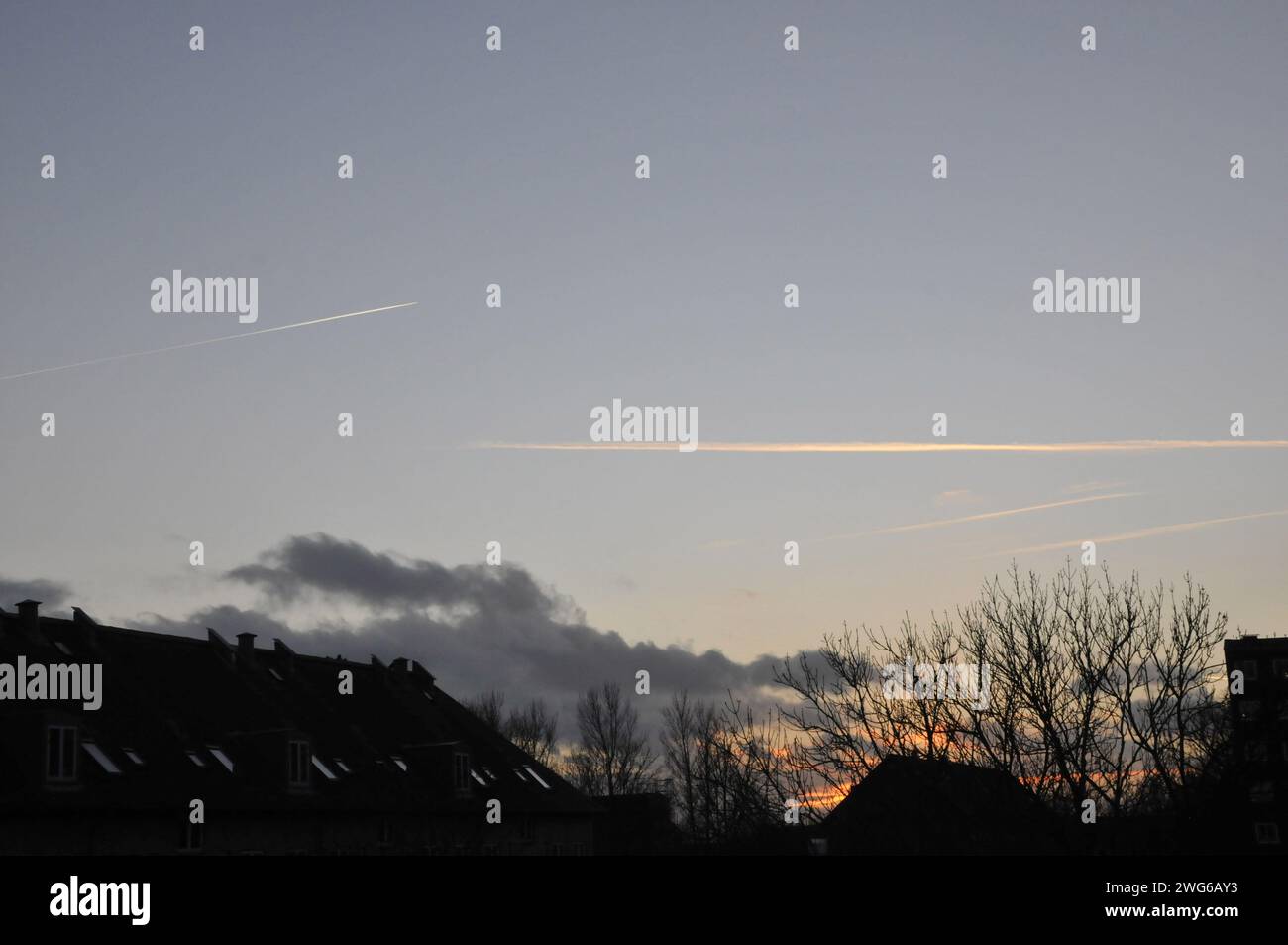 Copenhagen, Denmark /03 February 2024/. Flights smke lines over Ksstrup ...