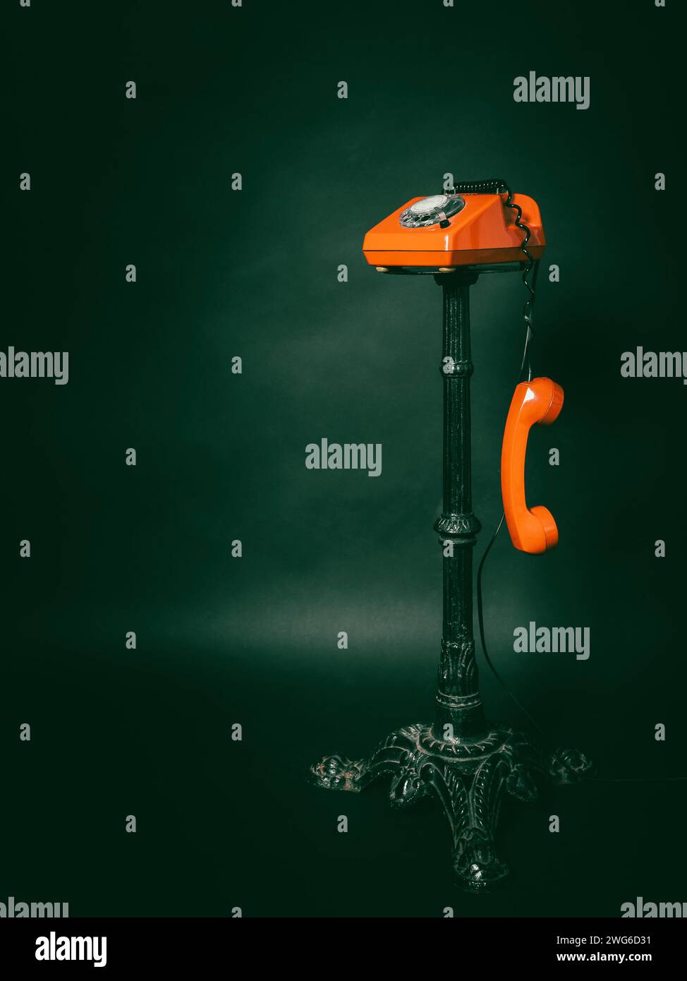 An old red telephone with a rotary dial, an old historical red ...