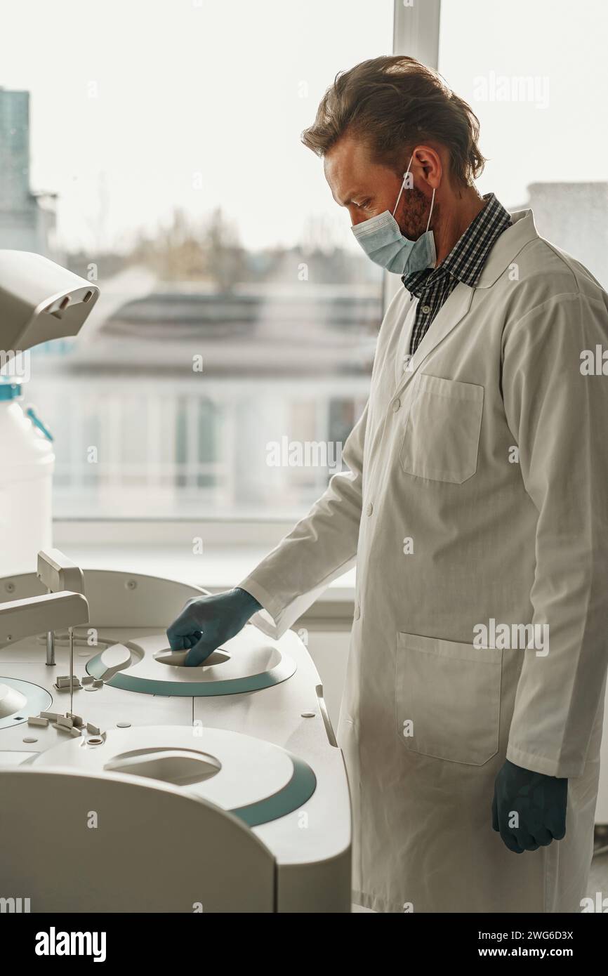 Male researcher in special equipment hi-res stock photography and ...