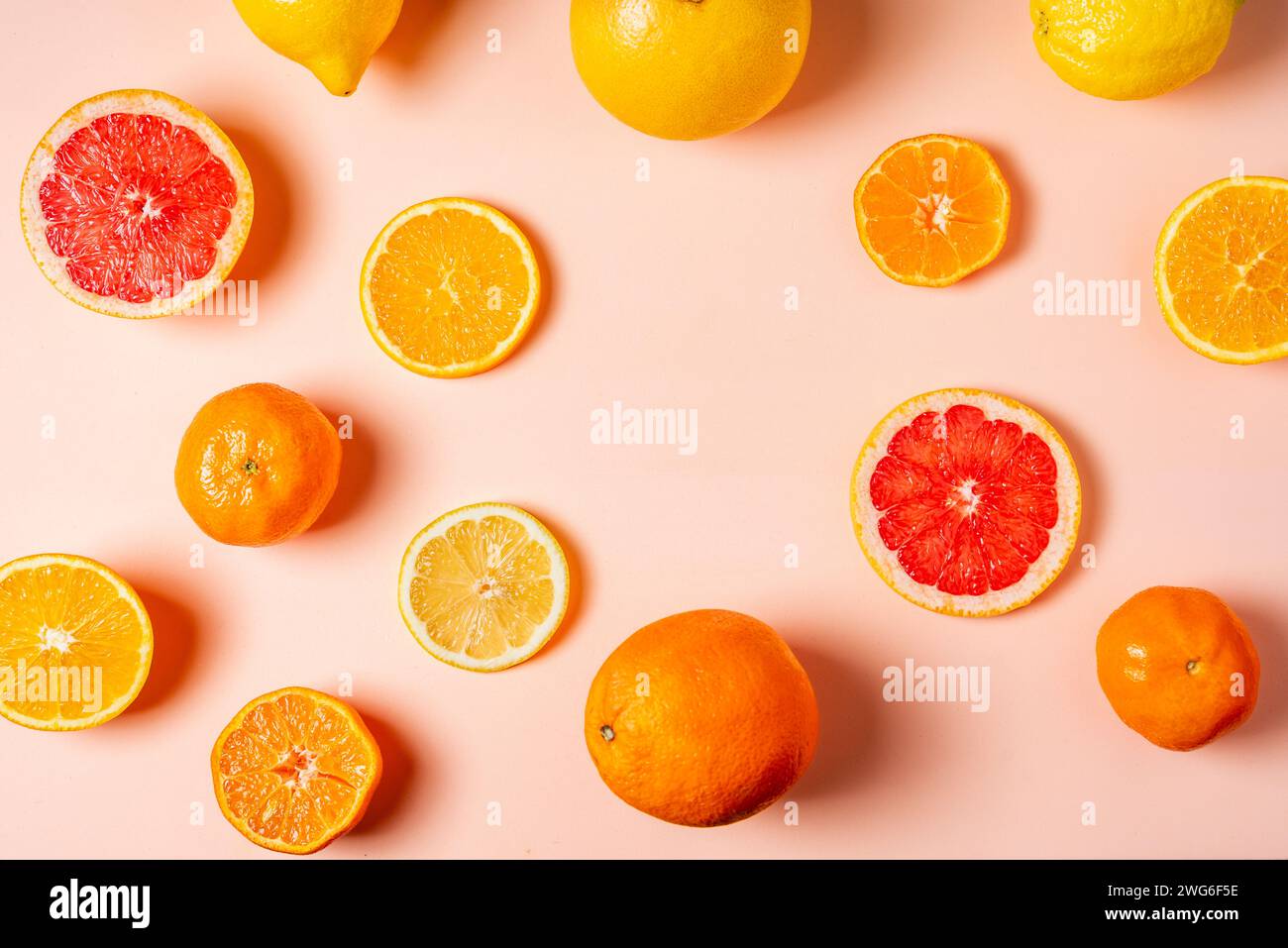 Collage of citrus fruits, whole, half and sliced, grapefruits, oranges, lemons and tangerines on ...