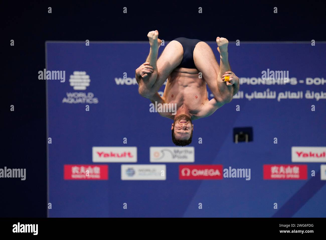 Lorenzo Marsaglia of Italy makes a dive during the men's 1m springboard ...