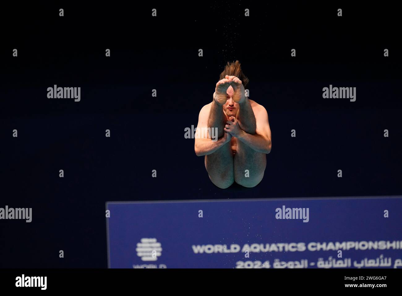 Kurtis Mathews of Australia makes a dive during the men's 1m ...