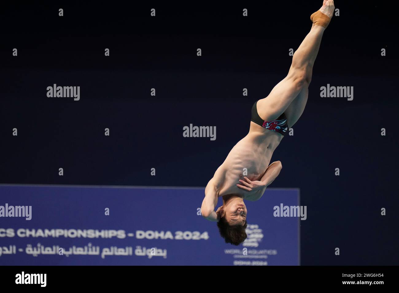 Jiuyuan Zheng of China makes a dive during the men's 1m springboard ...