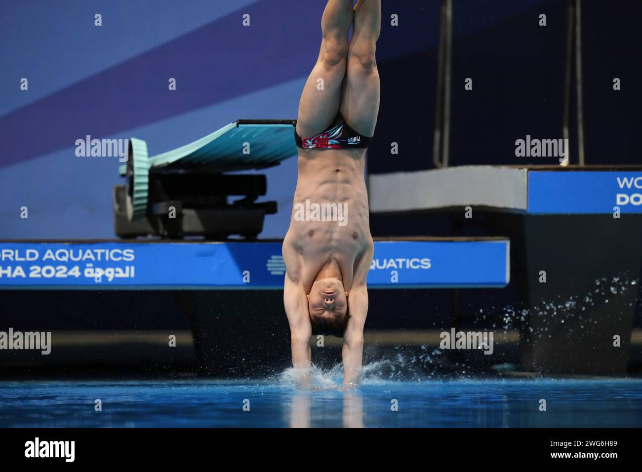 Jiuyuan Zheng of China makes a dive during the men's 1m springboard ...