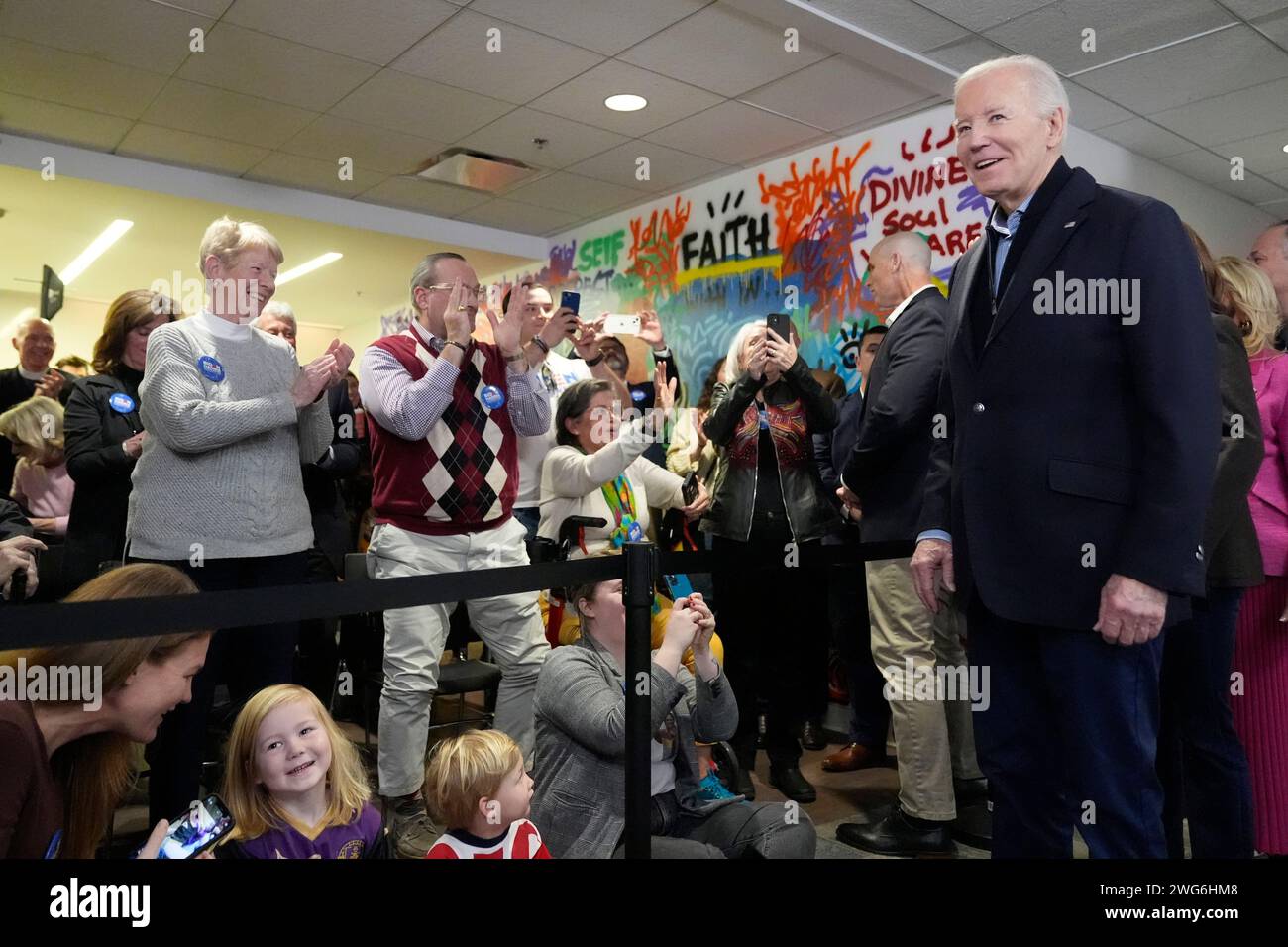 President Joe Biden, right, greets staff and volunteers at the Biden ...