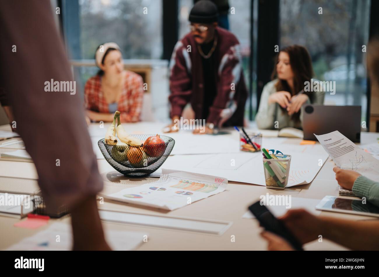 Multiracial team of business professionals engaged in creative ...