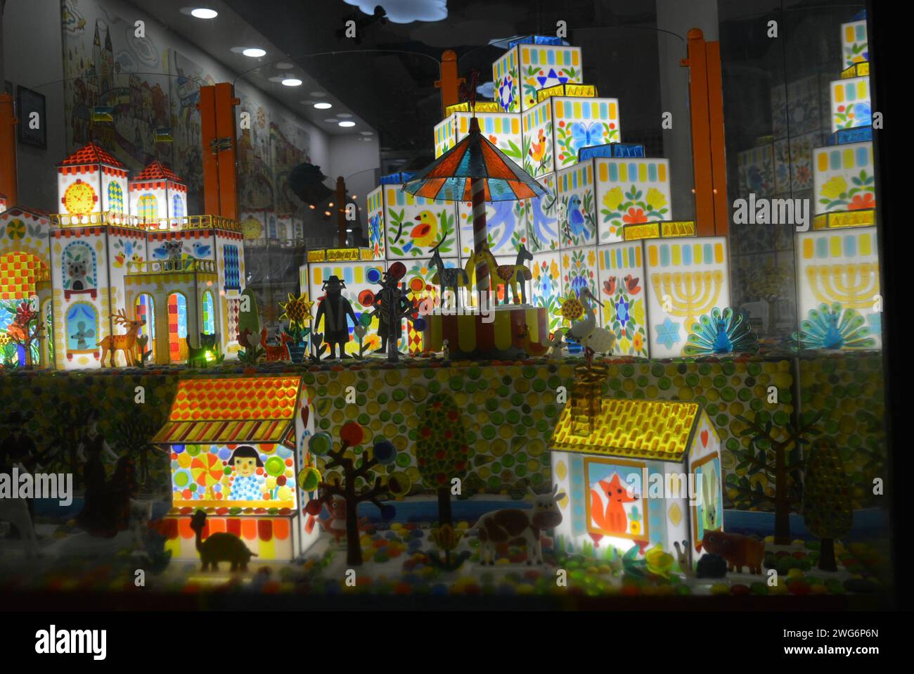 Glowing caramel houses and caramel figurines of the cityscape with ...