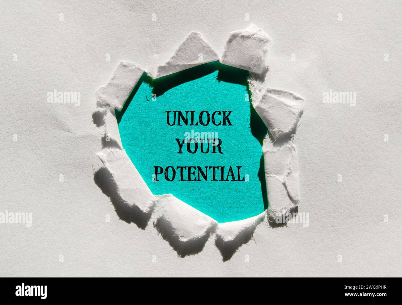 Unlock your potential lettering on ripped paper. Conceptual business ...