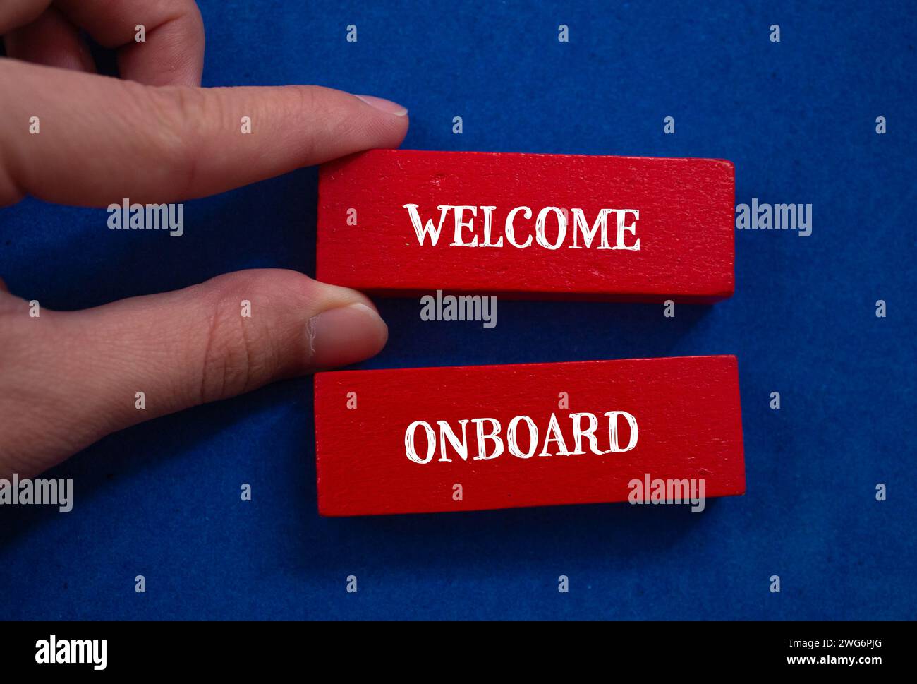 Welcome onboard lettering on red wooden blocks with blue background ...
