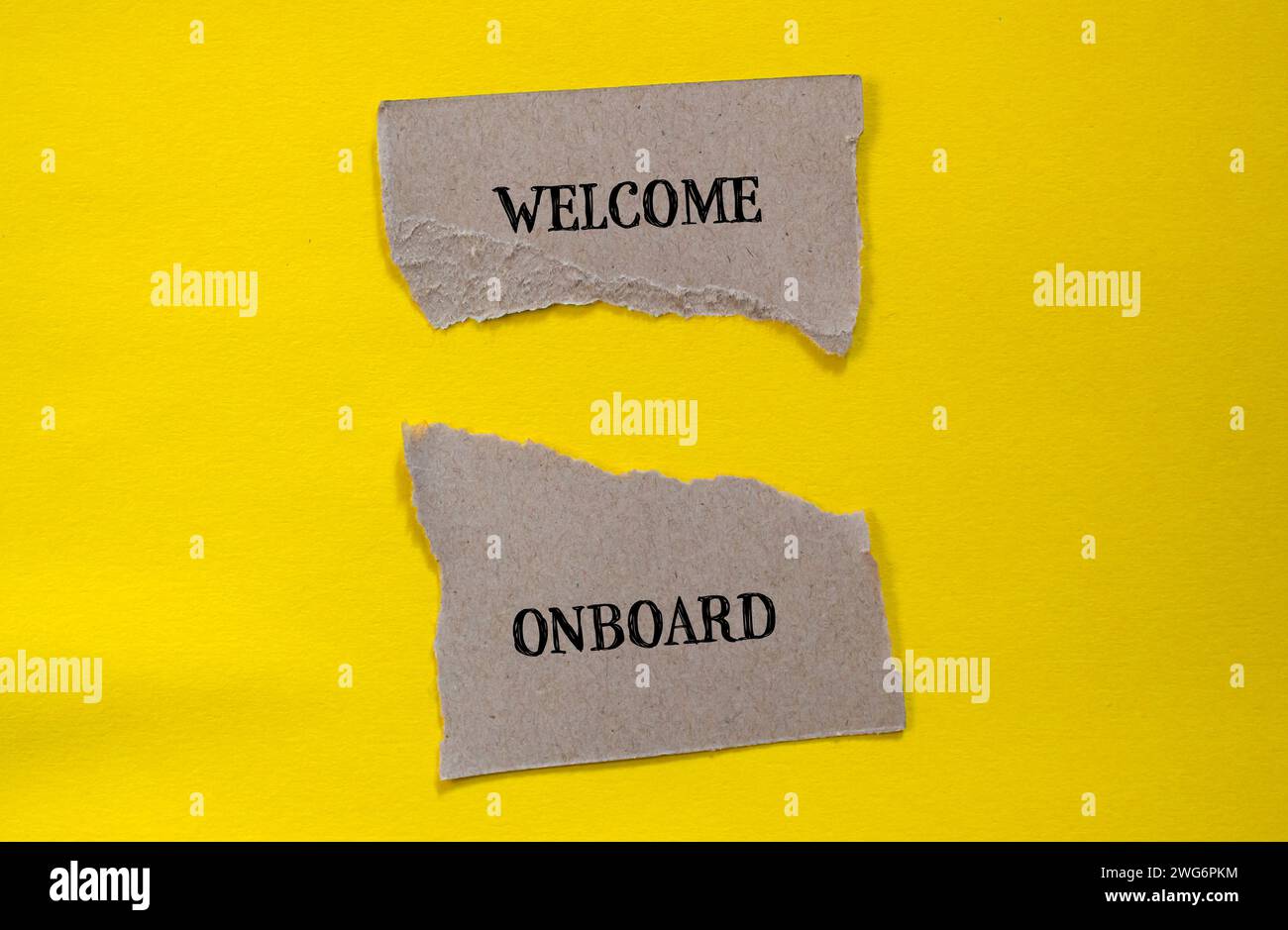 Welcome onboard lettering on ripped paper pieces with yellow background ...