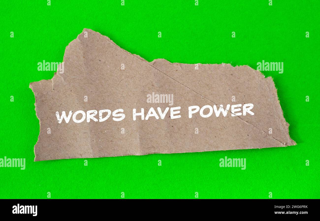 Words have power words written on torn paper piece with green ...