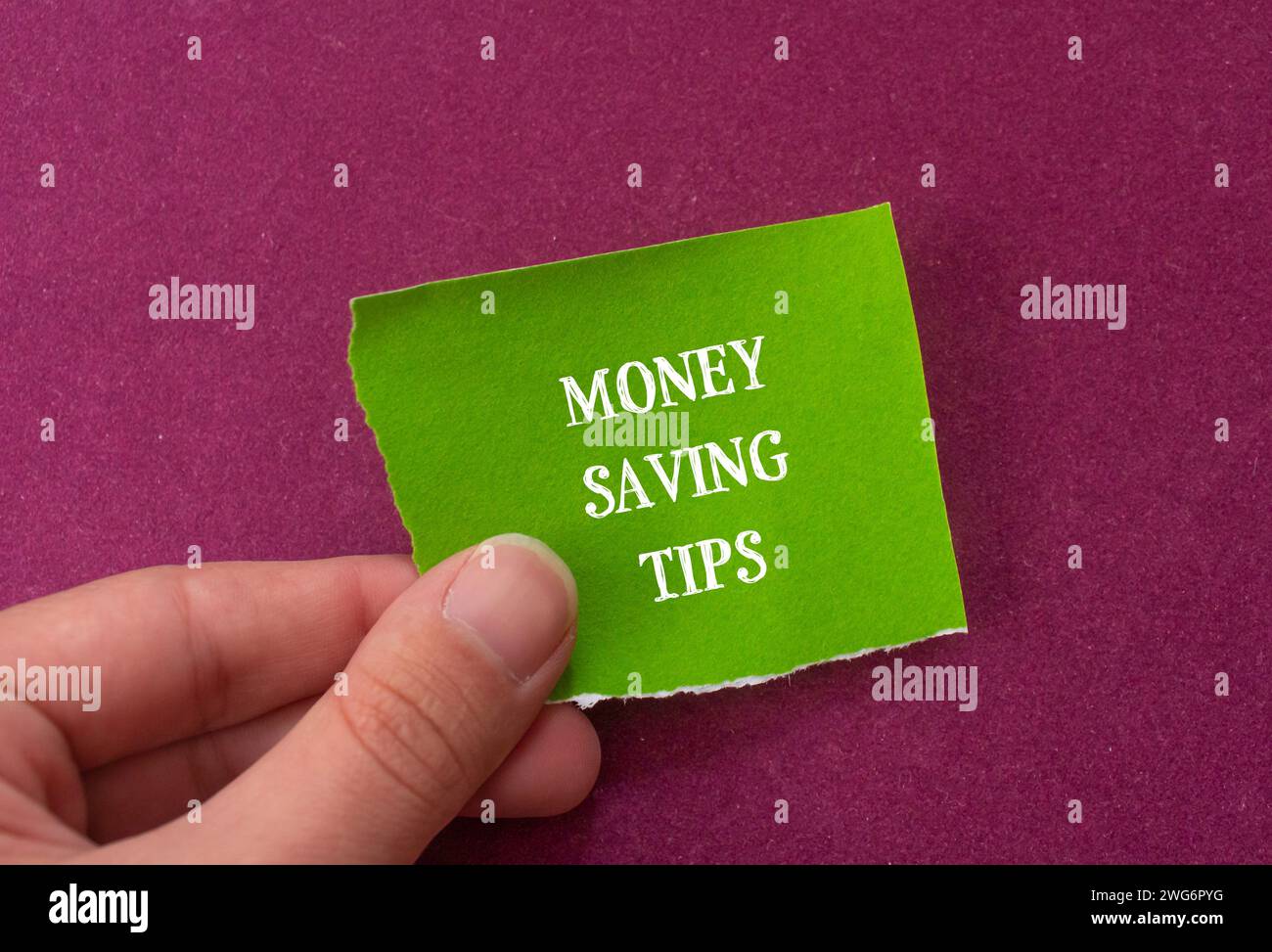 Money saving tips lettering on ripped paper with color background ...