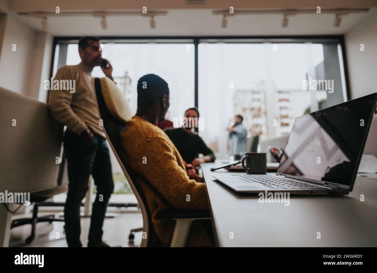 Creative team brainstorming session in a modern office space with ...