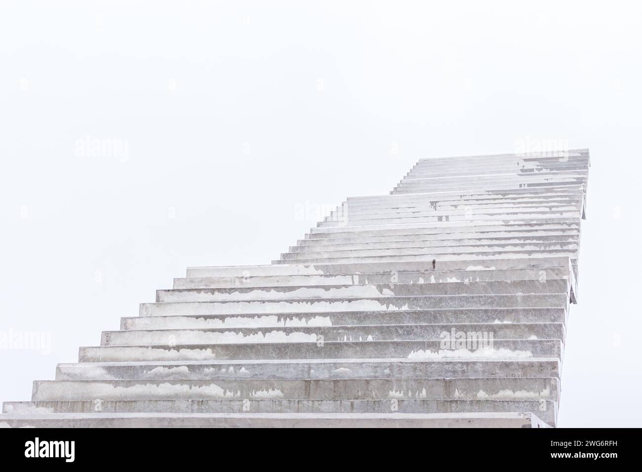 Stairs to nowhere. Empty unfinished bridge. Outdoor staircase without ...