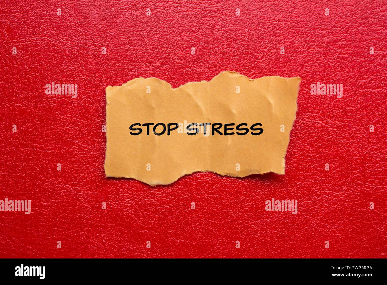 Stop stress lettering on orange torn paper with red background ...