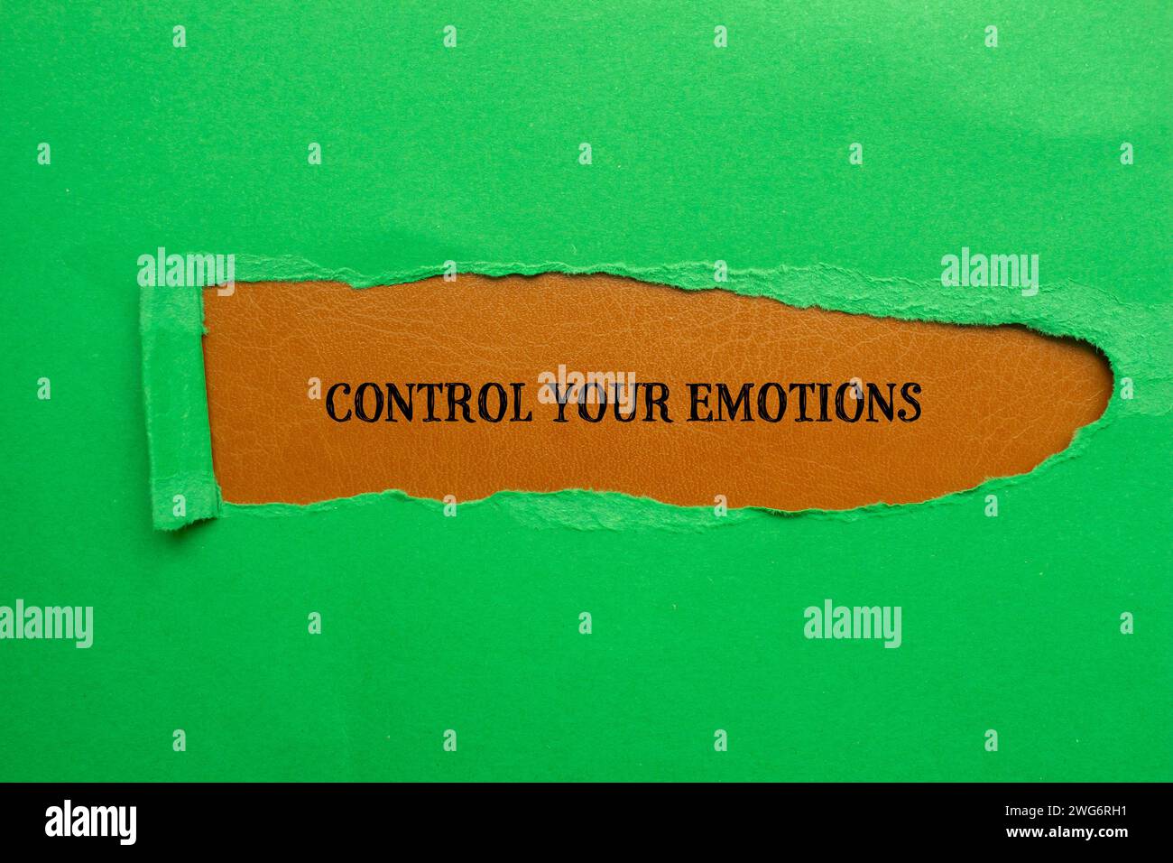 Control your emotions lettering on ripped paper with brown background ...