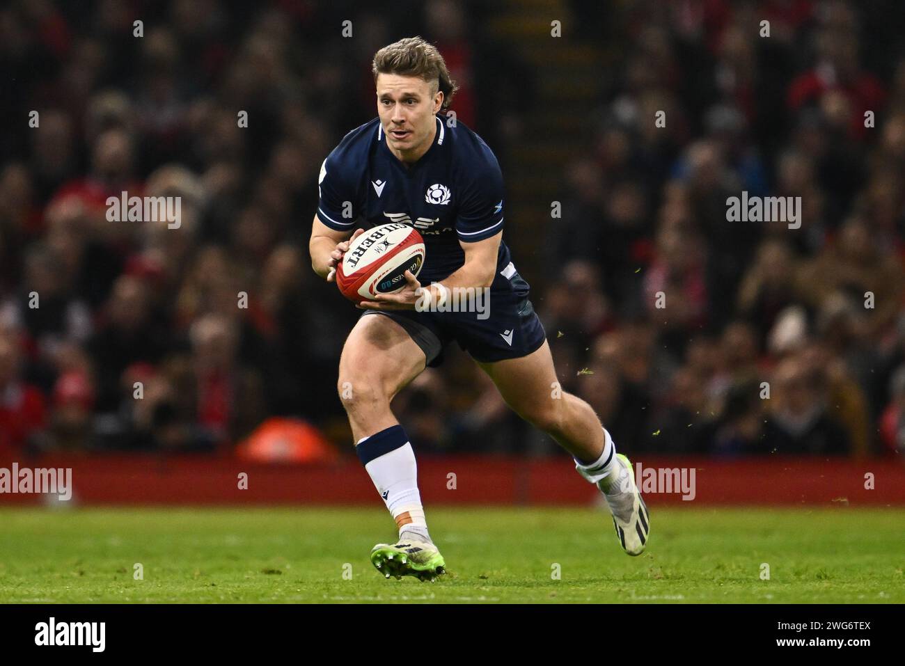 Kyle Rowe of Scotland makes a break during the 2024 Guinness 6 Nations ...