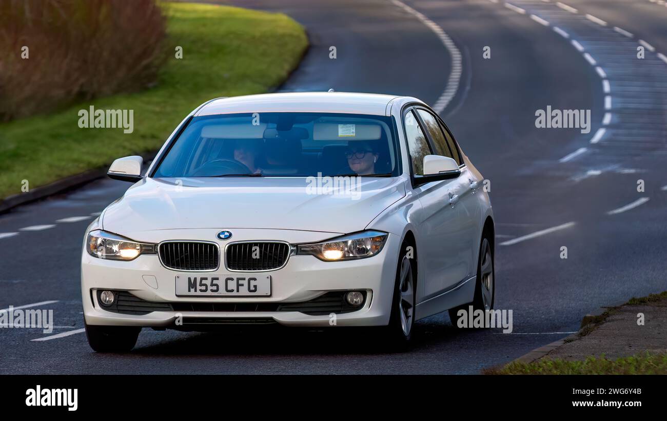 Milton Keynes,UK-Feb 3rd 2024: 2012 white diesel engine BMW 3 series ...