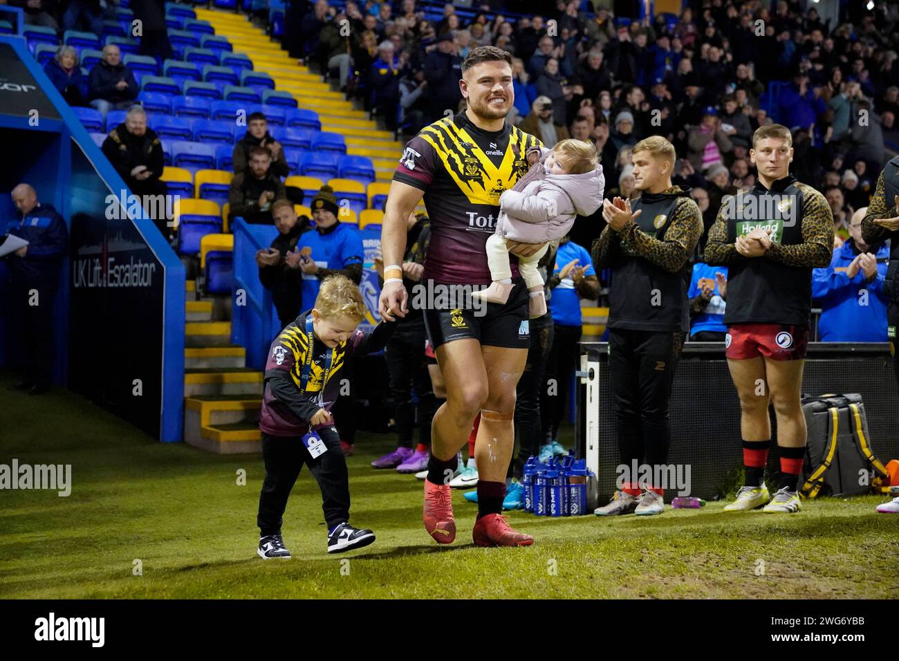 Joe Philbin of Warrington Wolves walks out with his children before the ...
