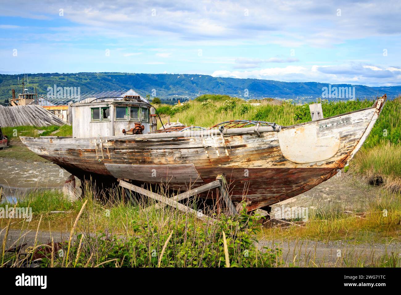 Boat graveyard on the Homer Spit, Homer, AK Stock Photo - Alamy