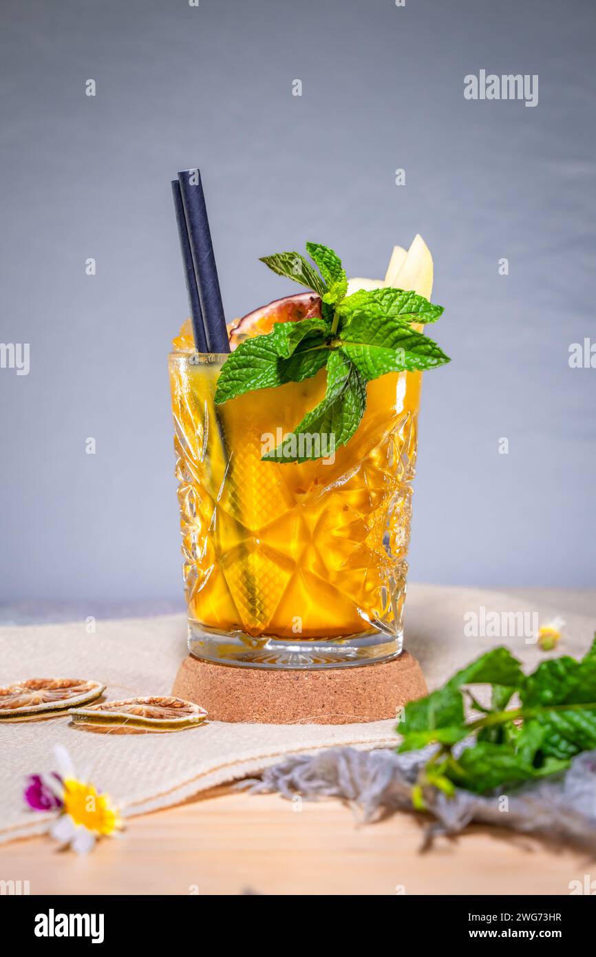 A glass of Brazilian passion fruit cocktail with fresh mint Stock Photo ...