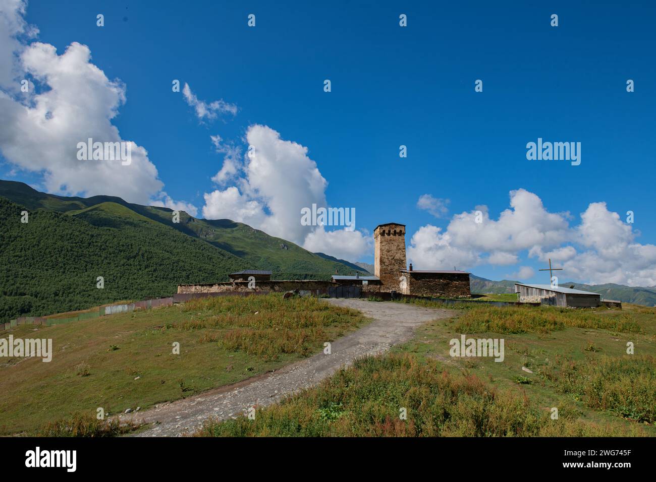 Timeless Beauty: Ruins, Mountains and Ethereal Clouds Stock Photo - Alamy