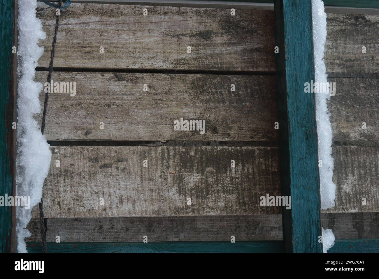 Wooden background from boards of gray and green color with melting snow in spring Stock Photo ...