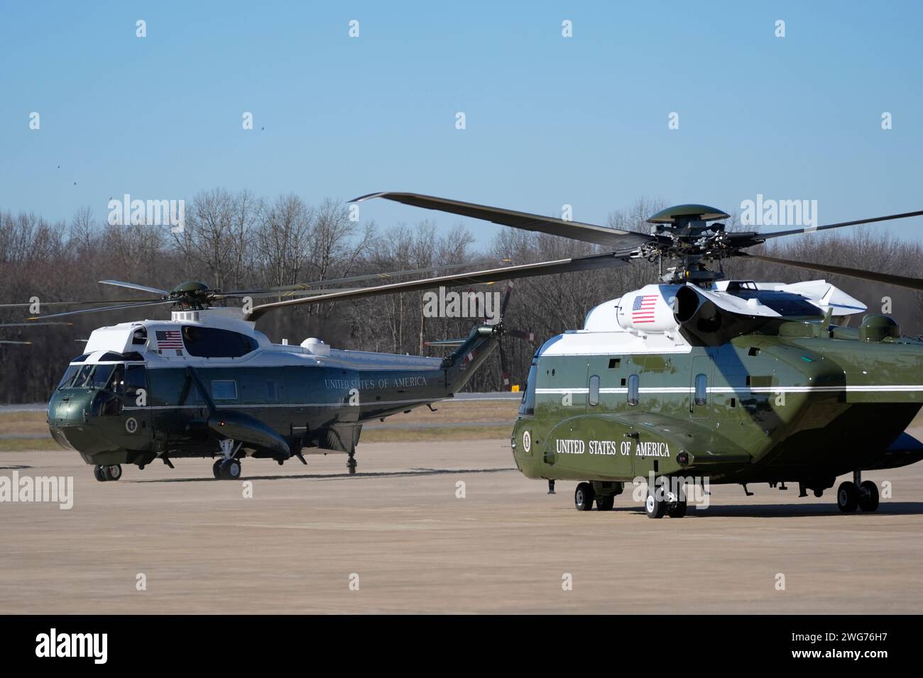 Marine One, left, sits alongside a new military helicopter, a Sikorsky ...