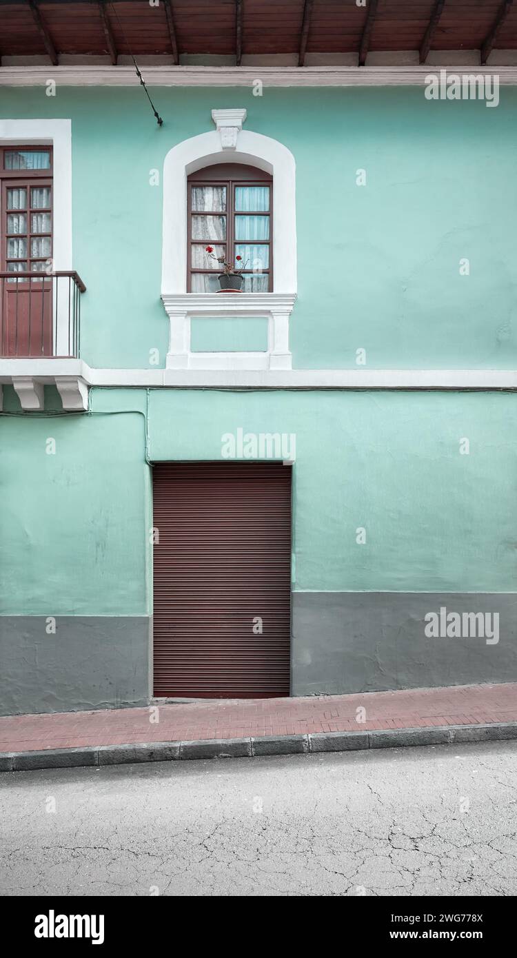 Street view of the facade of an old colonial building, Quito, Ecuador ...