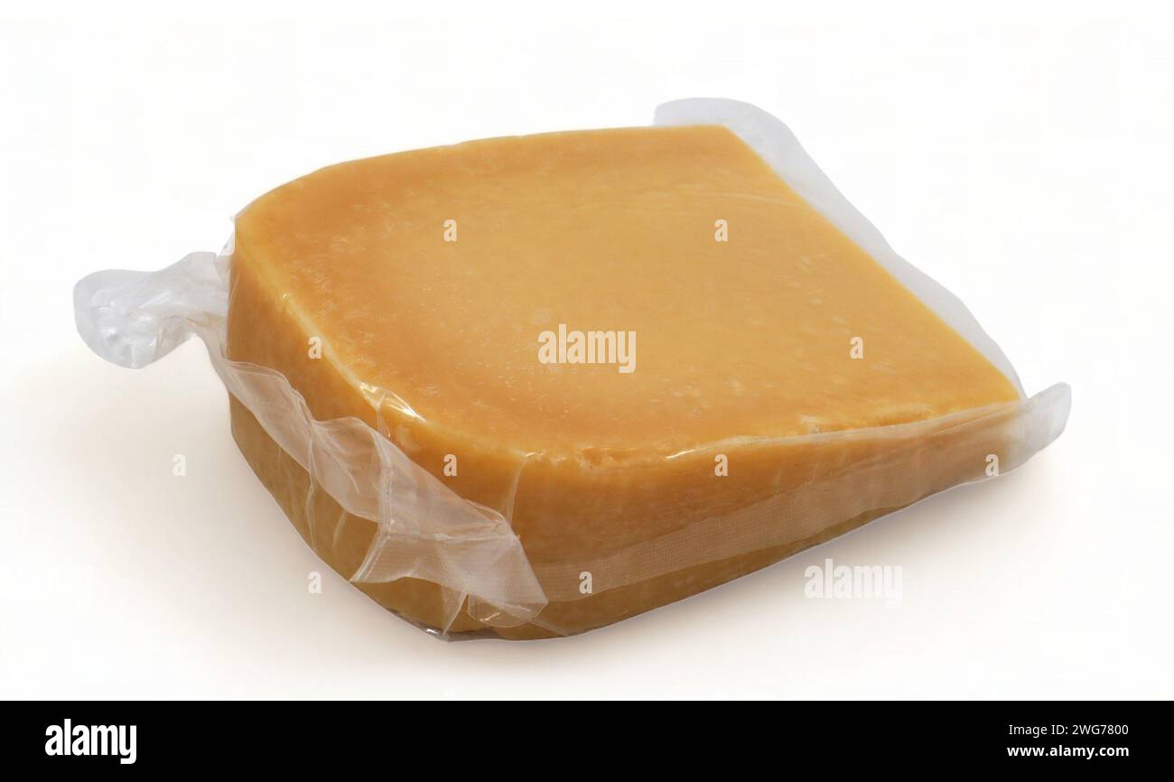 One parmesan cheese triangle in a transparent plastic wrap with soft ...