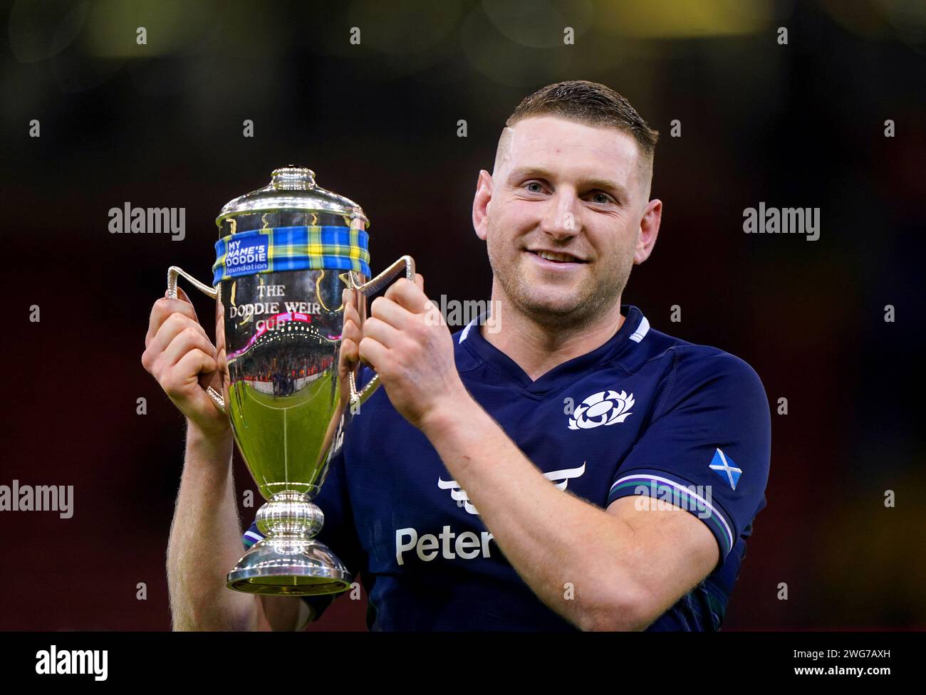 Scotland's Finn Russell celebrates with the Doddie Weir Cup at the end ...