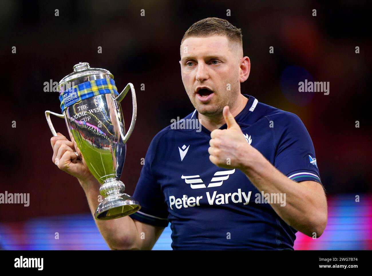 Scotland's Finn Russell celebrates with the Doddie Weir Cup at the end ...