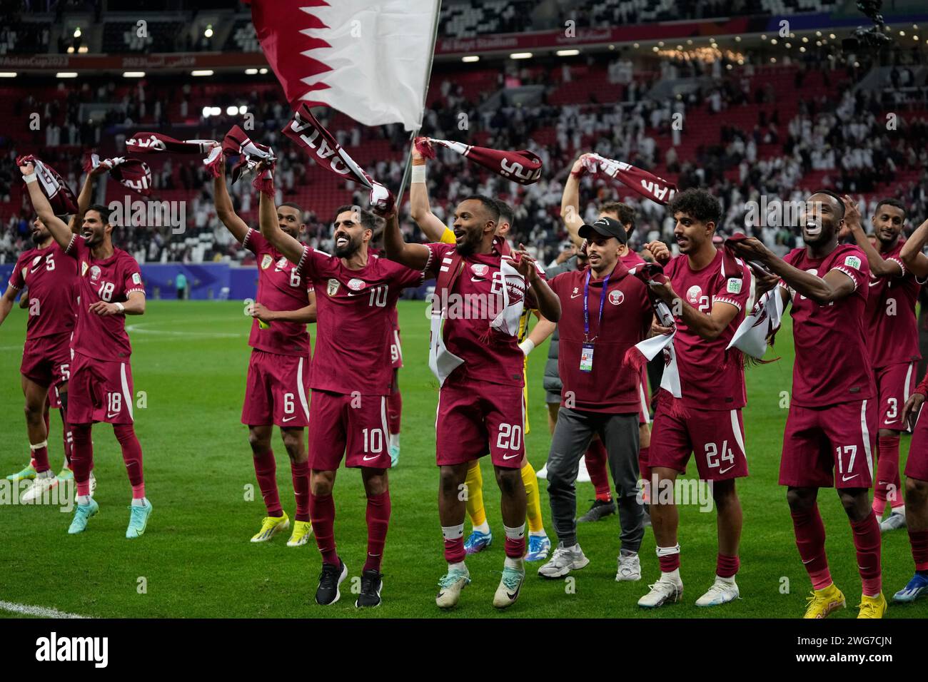 Qatar players celebrate their win during the quarterfinal soccer match ...
