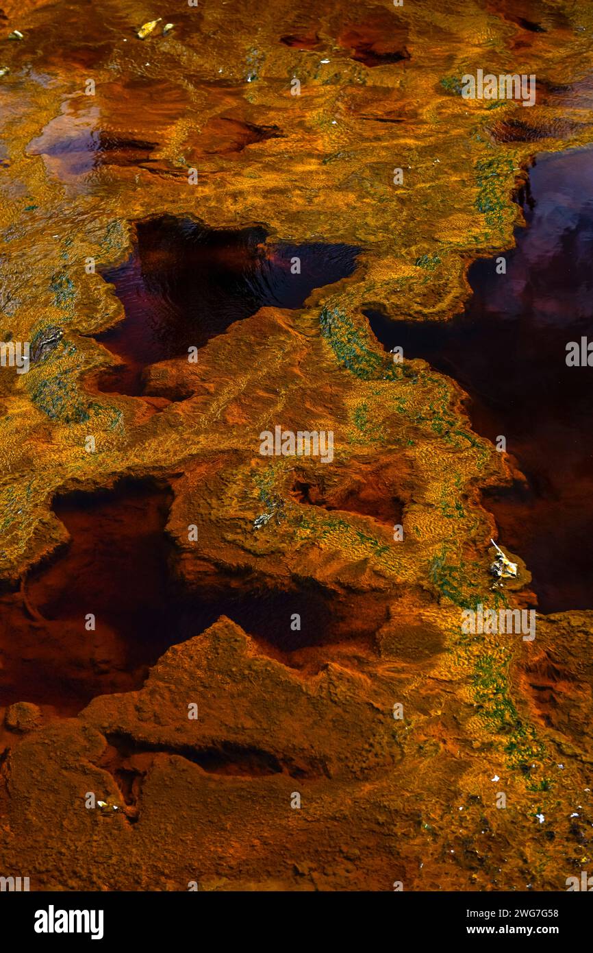 The Rio Tinto in Huelva, Spain, exhibits striking red and orange iron ...