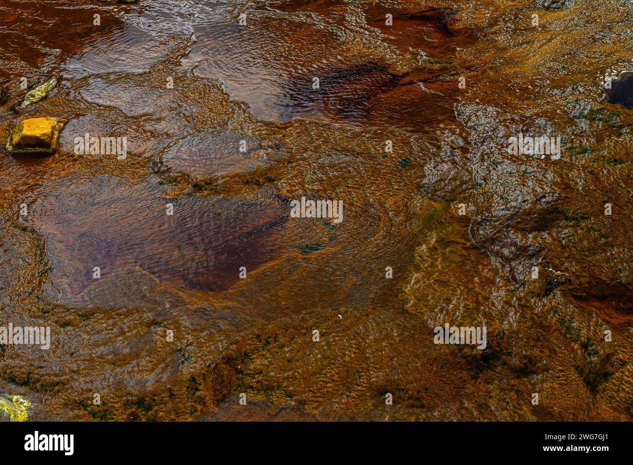 The Rio Tinto in Huelva, Spain, exhibits striking red and orange iron ...