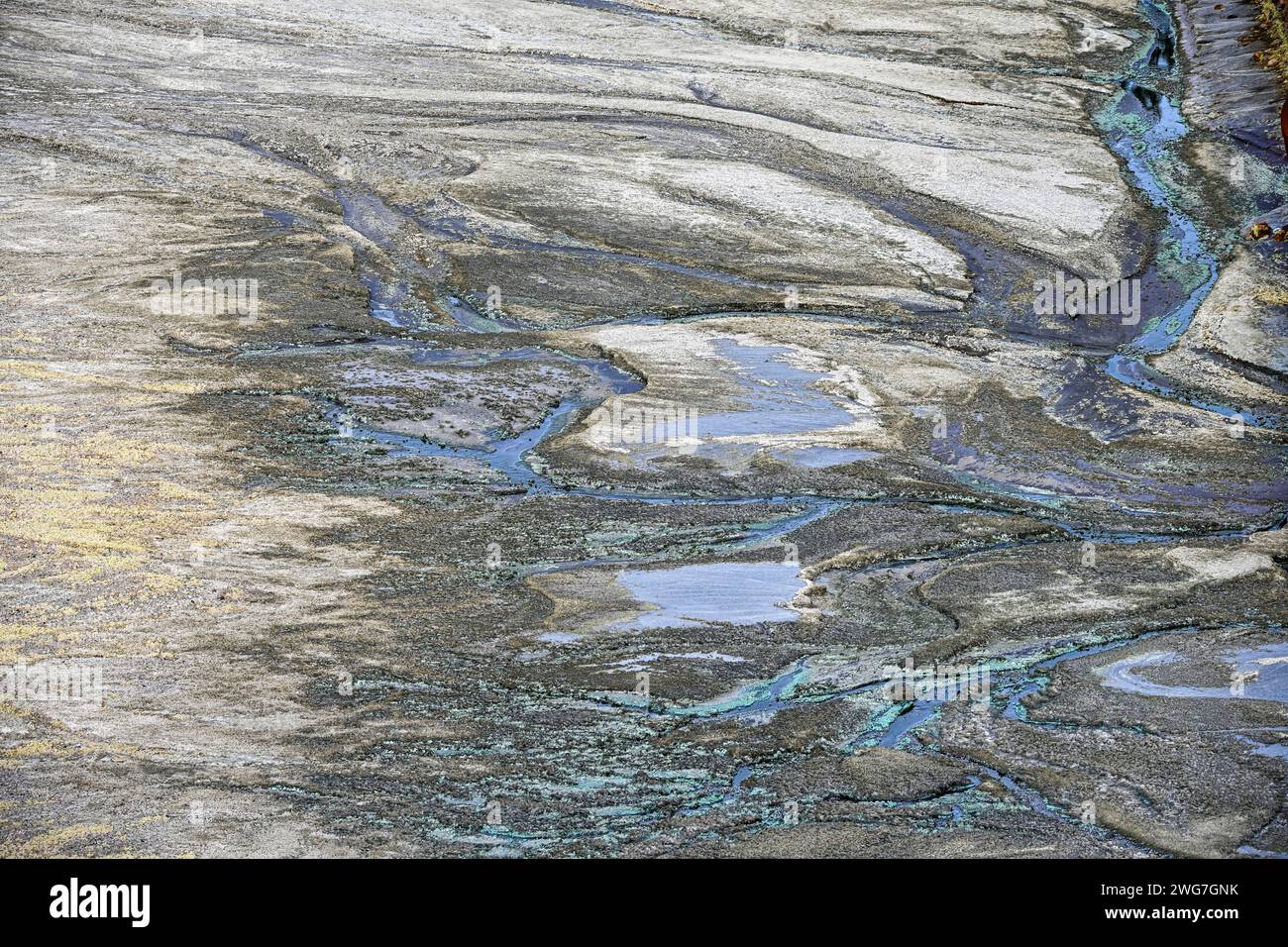 Naturally striated rock formations with traces of blue-green acidic ...