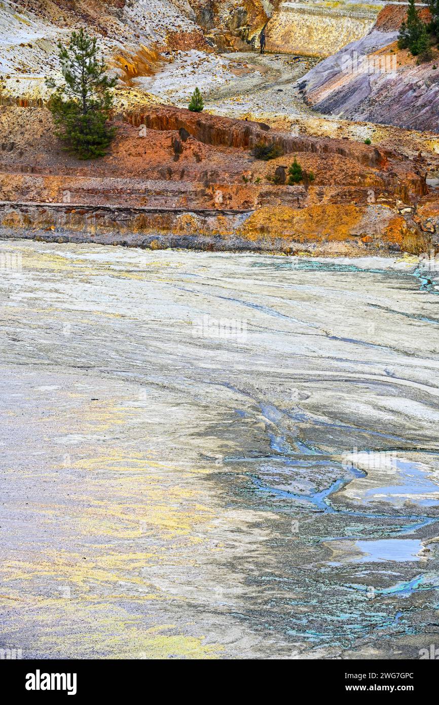 Naturally striated rock formations with traces of blue-green acidic ...